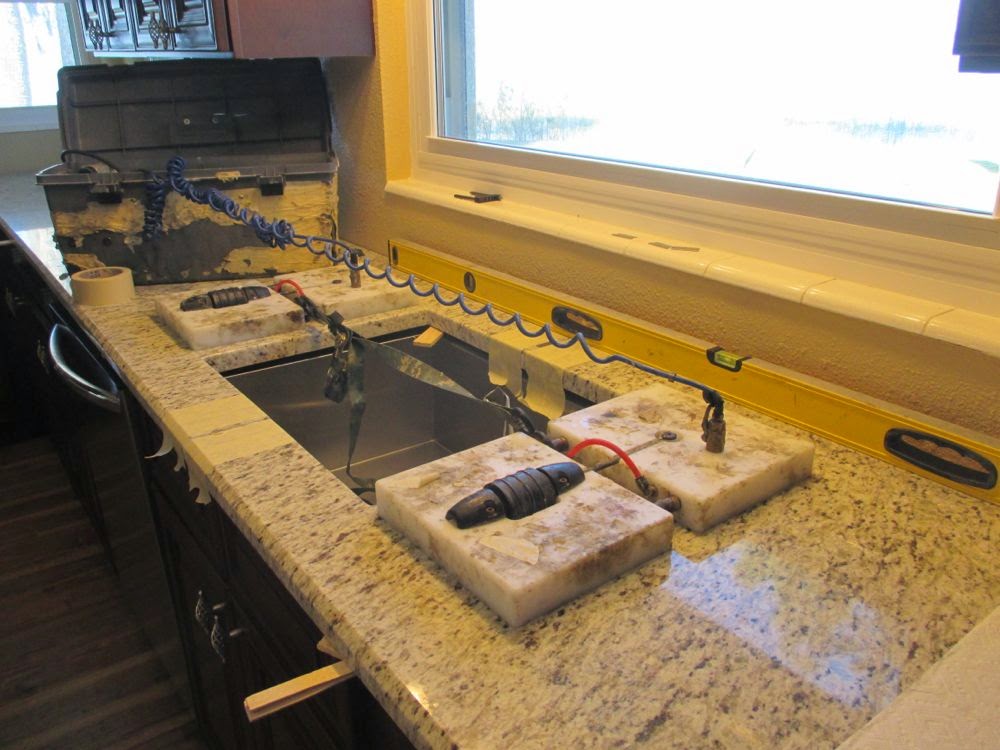 Mike and Lisa's World: New Gutters and A Granite Counter