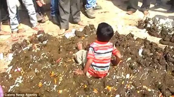 Pics: See Indian village where parents roll their children in manure in ...