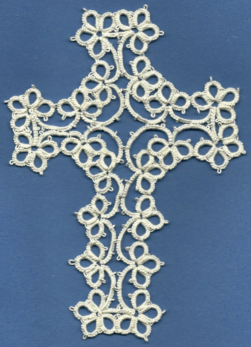 Taming Roses: A Pretty Cross using Clover motifs...