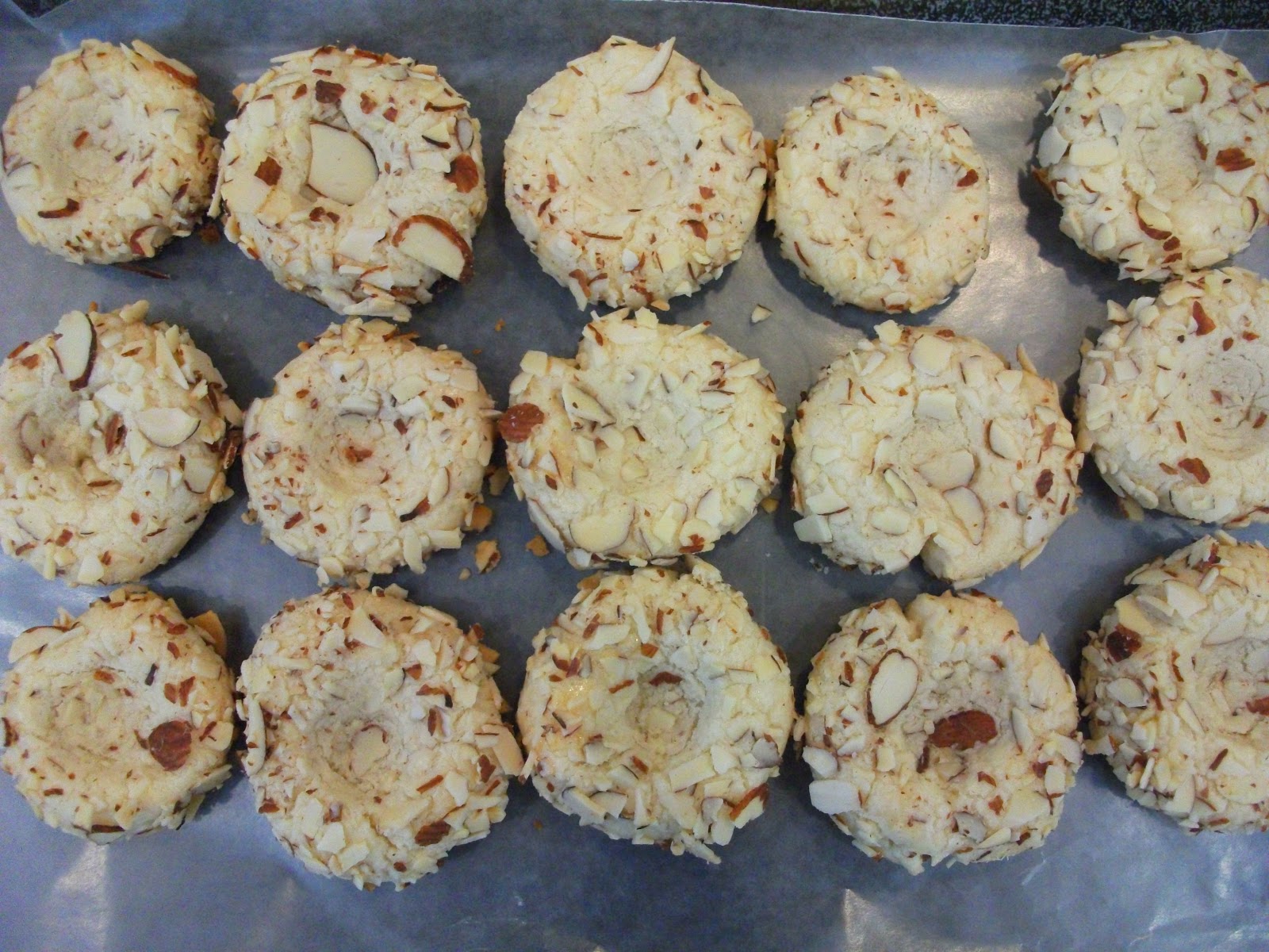 the tomato and the girl: almond thimble cookies with cranberry caramel