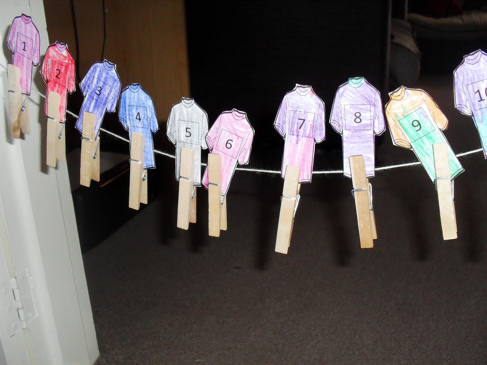 a muslim homeschool: Cuting, sticking and number clothes!