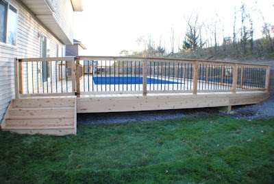 PENGUIN POOLS: Inground pool built into slope and decked