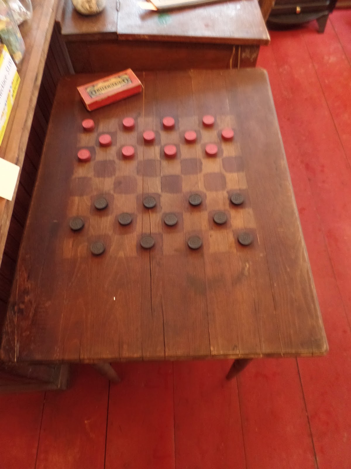 Log Cabin Antiques & Gifts: Old checkerboard table with old wooden checkers