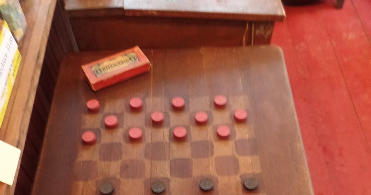 Log Cabin Antiques & Gifts: Old checkerboard table with old wooden checkers