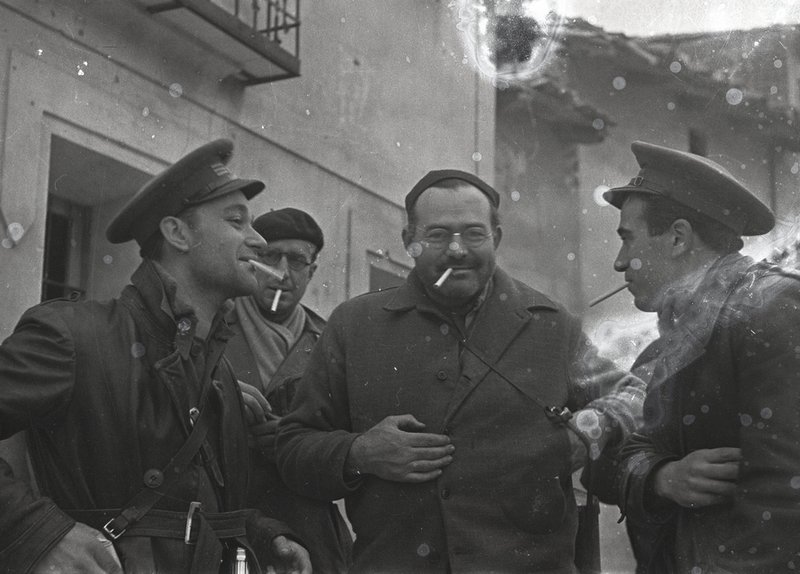 Ernest Hemingway having a smoke with two republican soldiers and Times ...