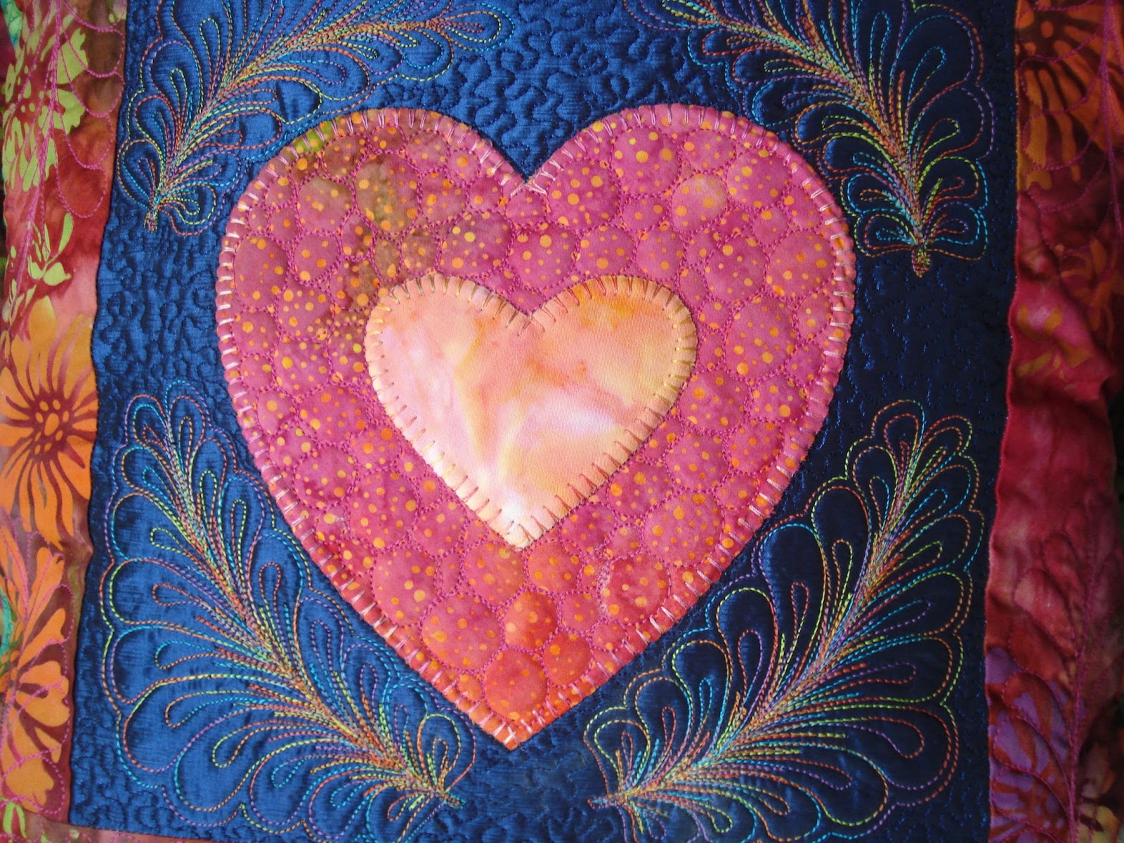 The Nifty Stitcher: Batik Heart Cushion with Quilted Feathers