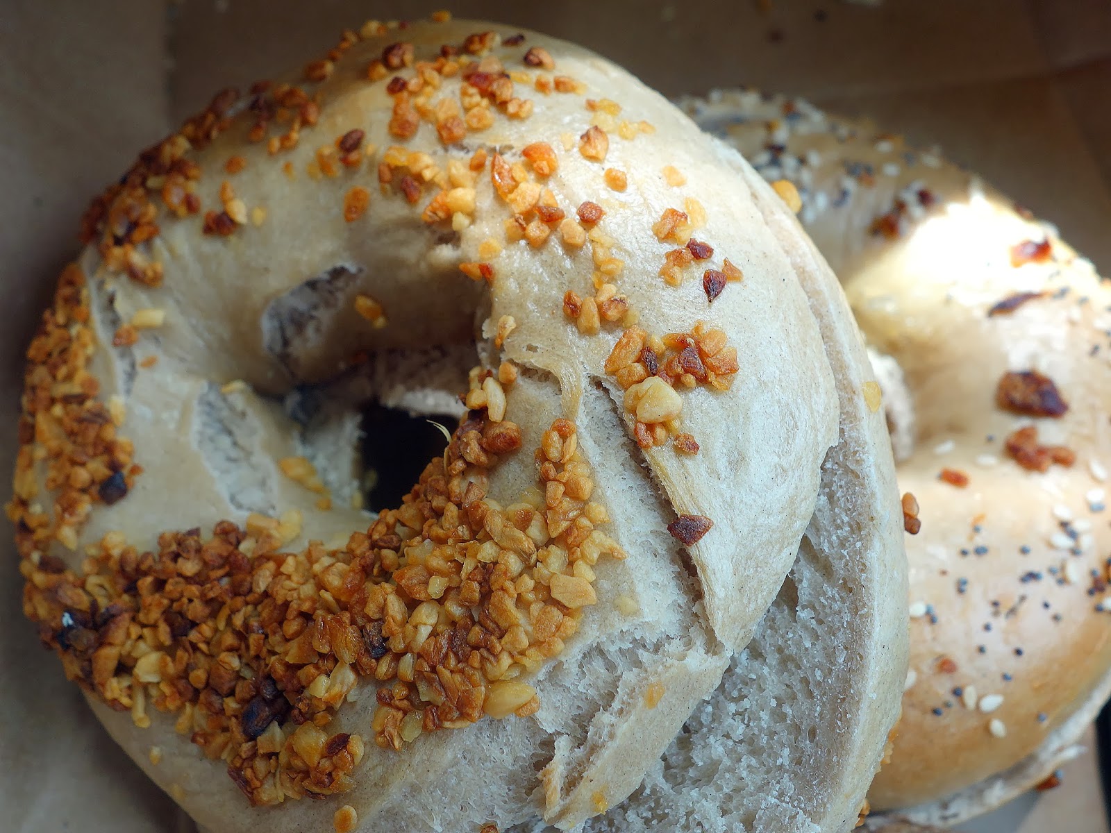 Regular bagels range from savory ones flavored with onions, poppy seeds ...