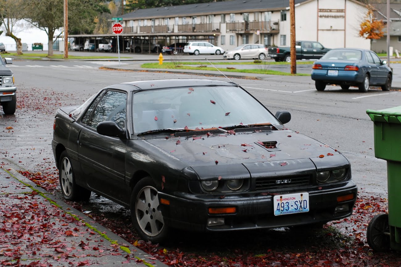 OLD PARKED CARS.: 1991 Isuzu Impulse RS Turbo.