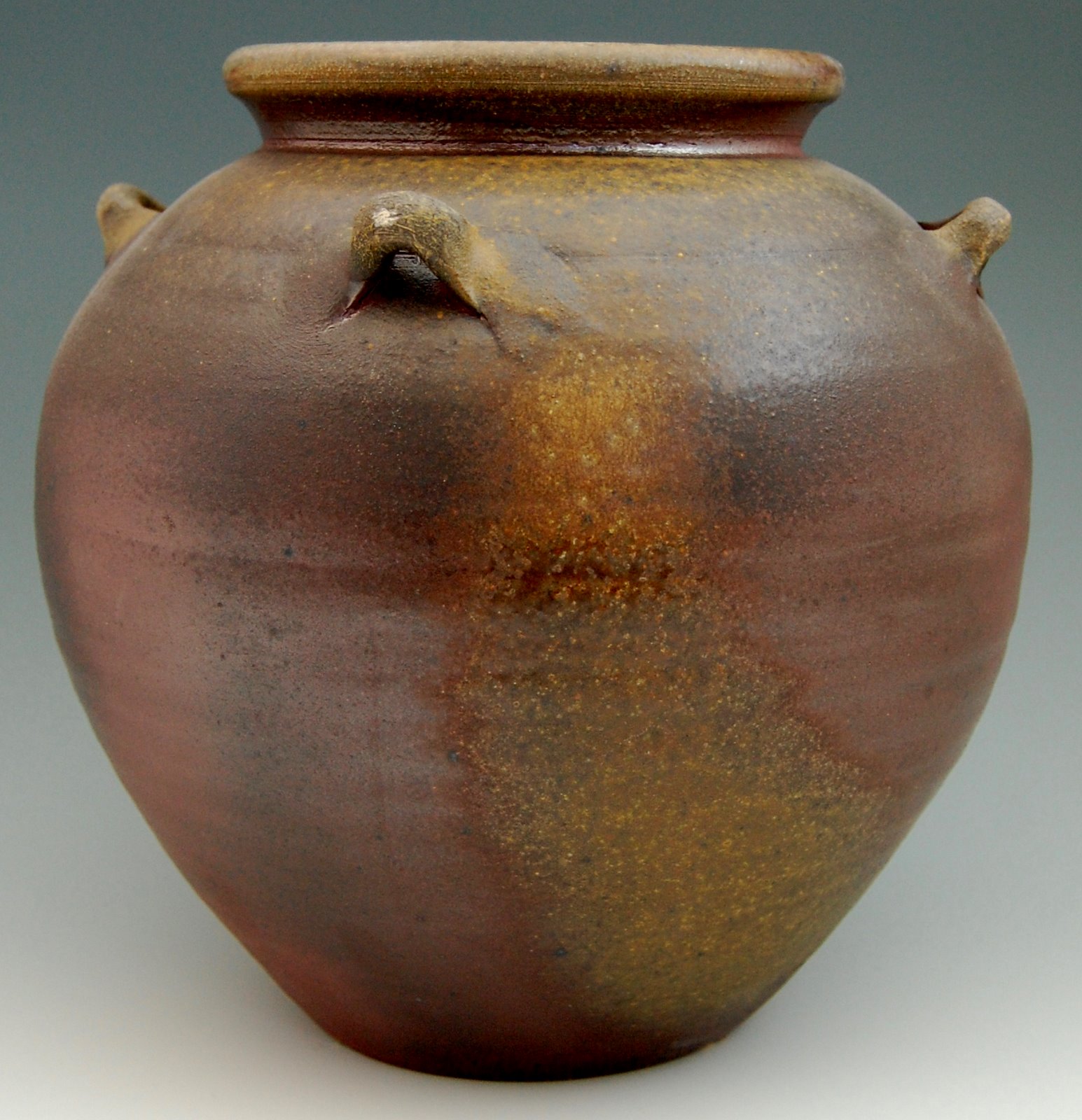 wood fired pottery: Two Tsubo and a Chawan made from a mid fire red clay.