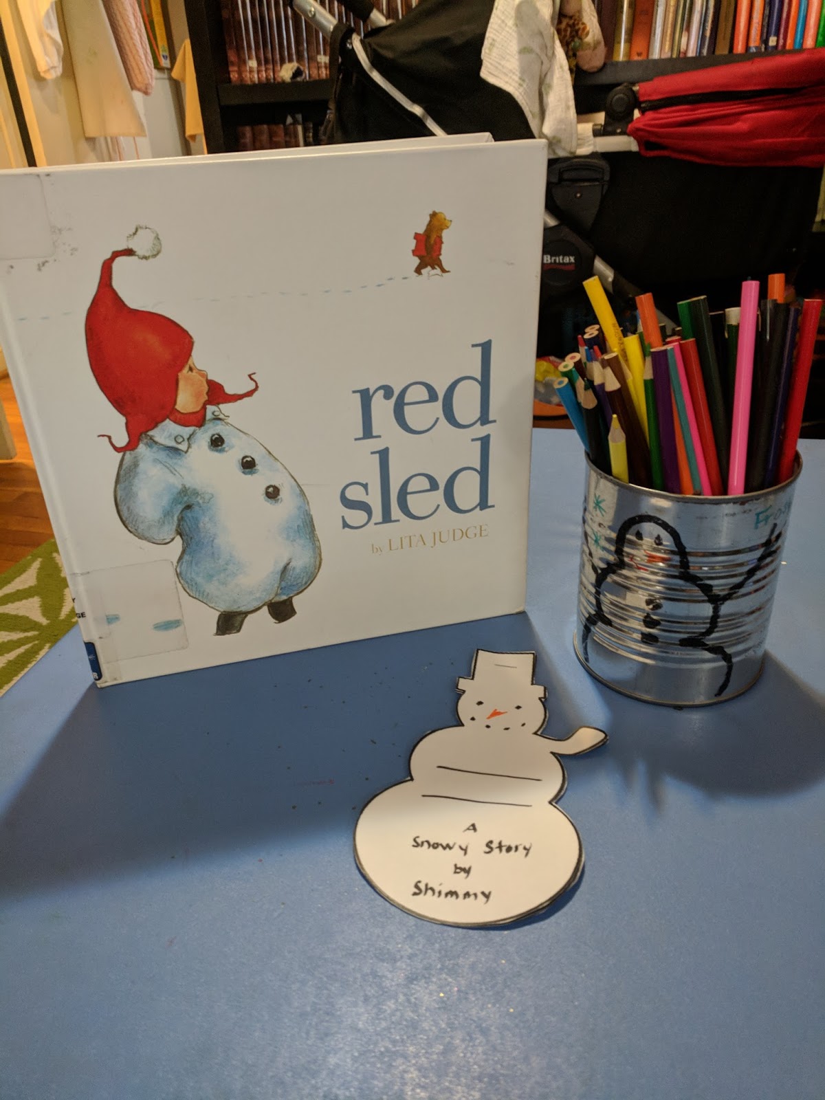 In Praise of Play: Beyond the Book: red sled by Lita Judge