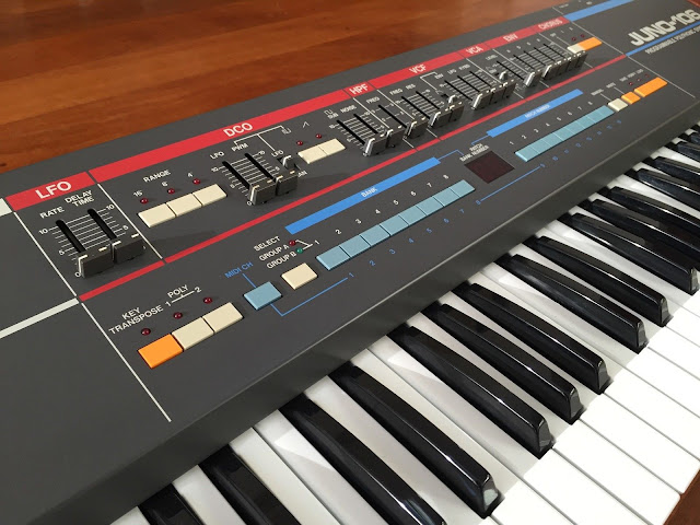 MATRIXSYNTH: Mint Roland Juno 106 with Wood Side Panels