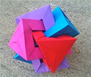 The Origami Hen: Four Interlocking Prisms
