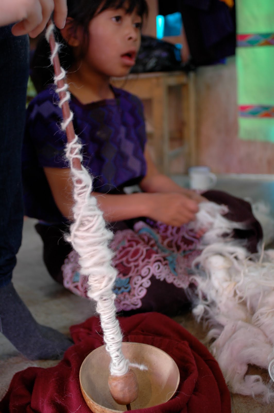 Artists Helping Artisans: Preparing wool stage 2 - brushing and spinning
