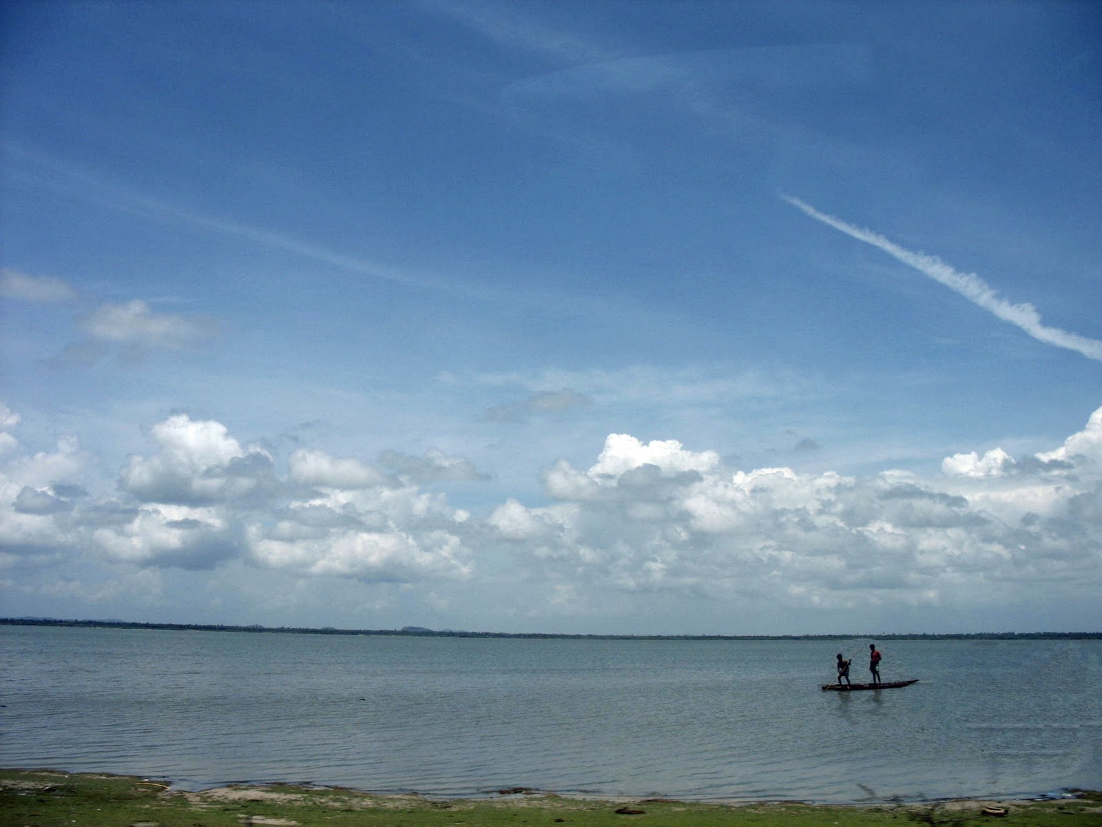 Stock Pictures: Two boatmen in a canoe in the ocean