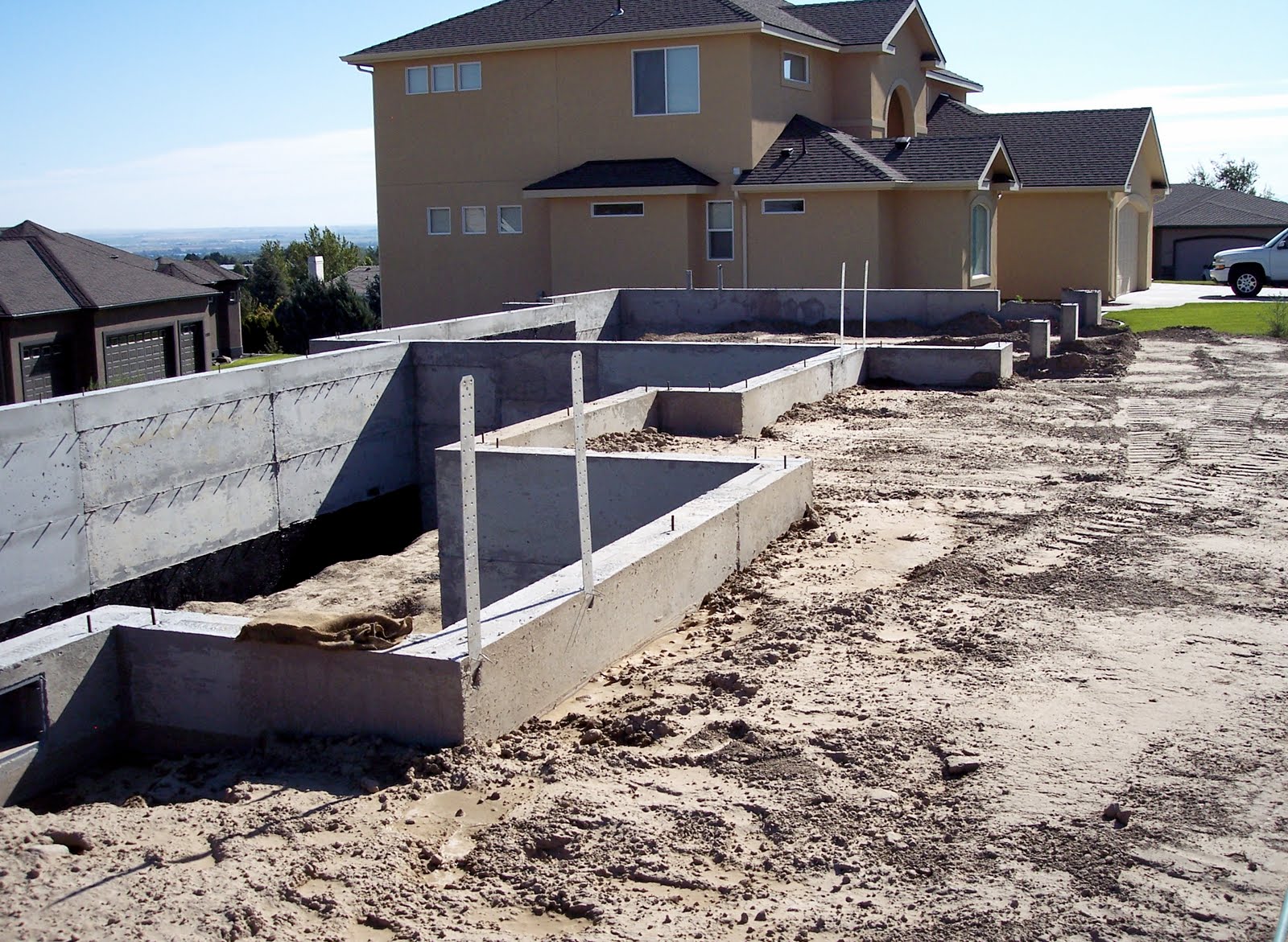 Building a Home: Foundation Walls Backfilled