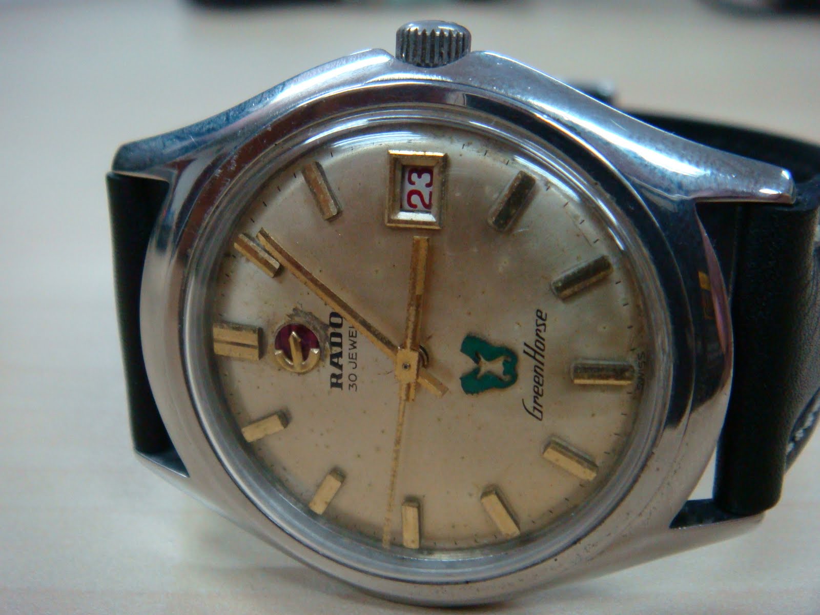 kunci jam: Rado Green Horse