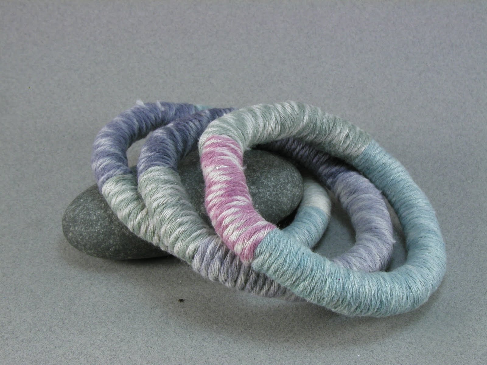 Knots and fiber bracelets: Fiber wrapped slip on bracelets 181