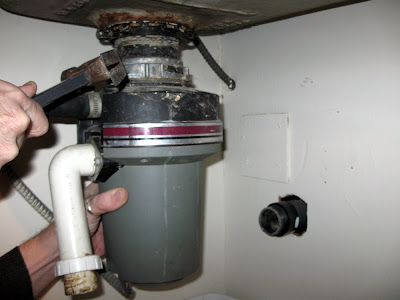 Just a girl with a hammer: The new garbage disposal!