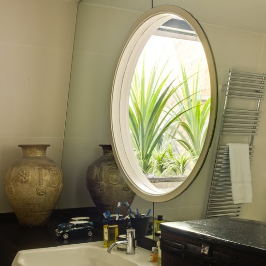 Minimalist Architecture and Home Interior: Round bathroom window