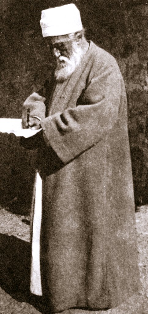 'Abdu'l-Baha in the Holy Land: 'Abdu'l-Baha signing a Tablet