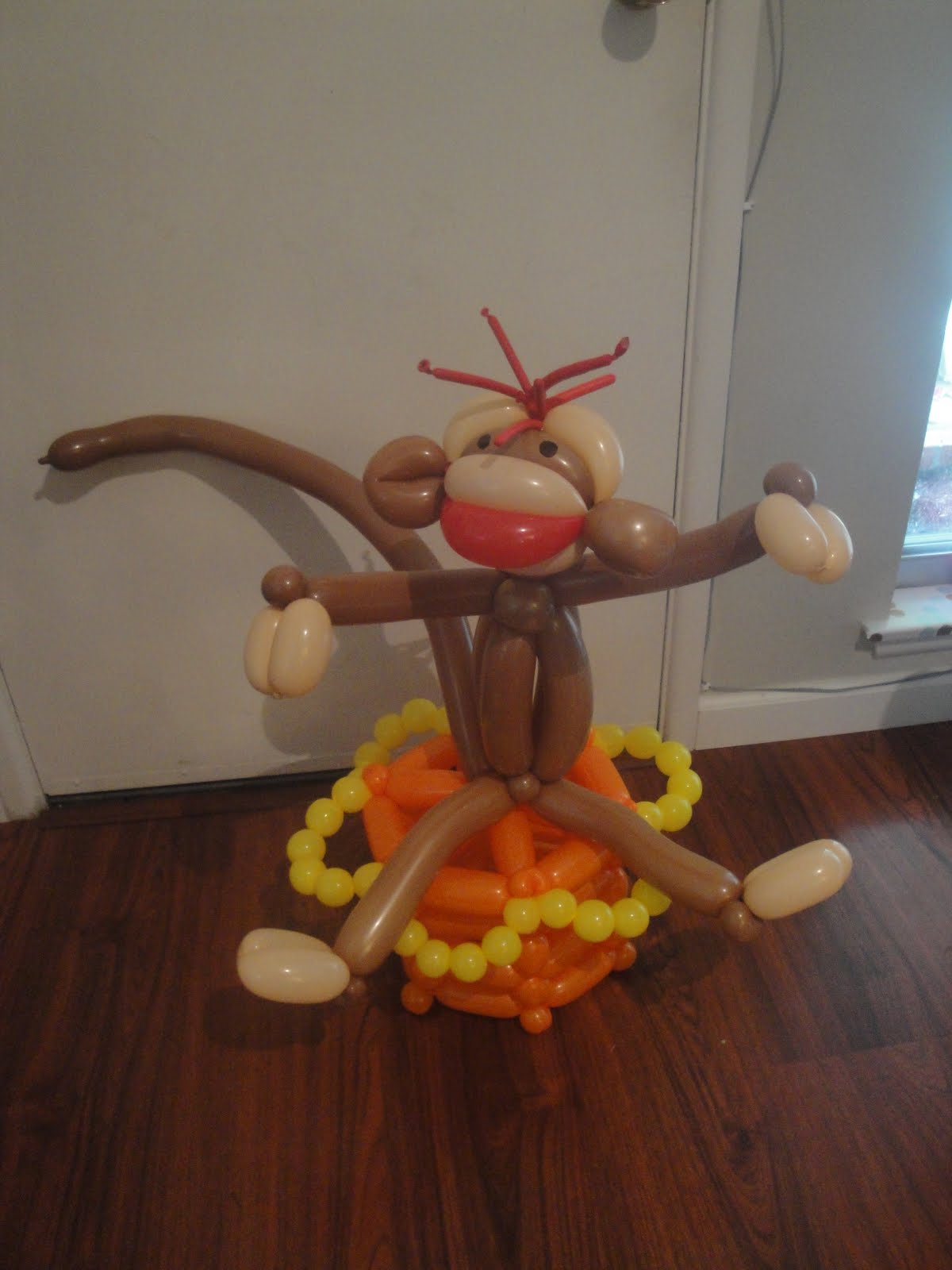 Balloon Twisting With Lien: Sock monkey balloon hat
