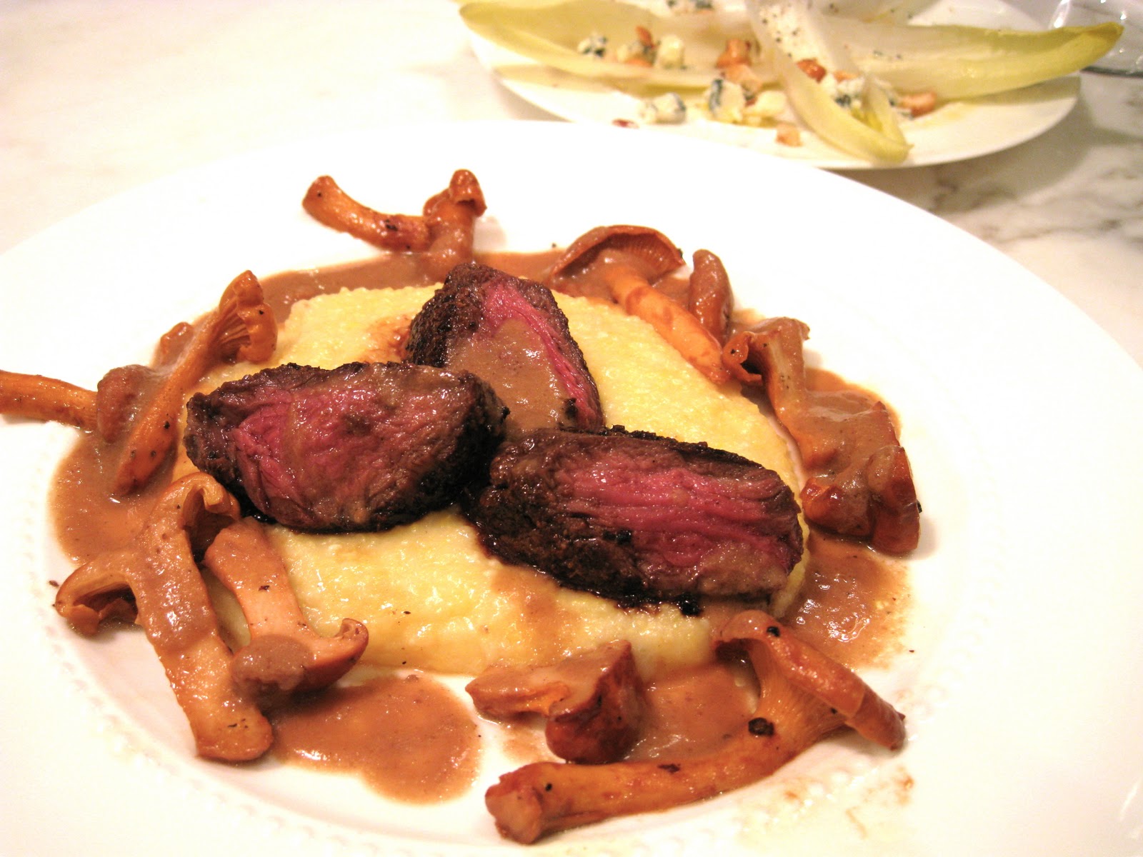 Mt. Adams Grass Fed Hanger Steak, Creamy Grits, Endive Salad