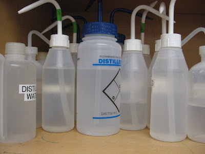 science visuals: Distilled water bottles