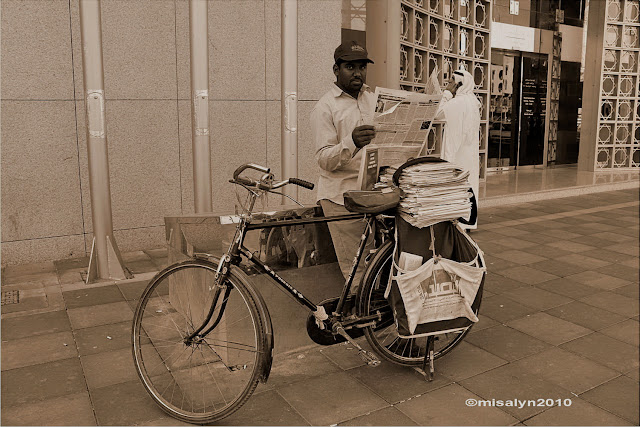 Monochrome Splendor: Newspaper delivery man