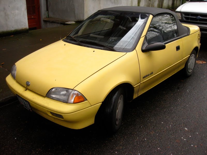 OLD PARKED CARS.: 1990 Geo Metro LSi Convertible.