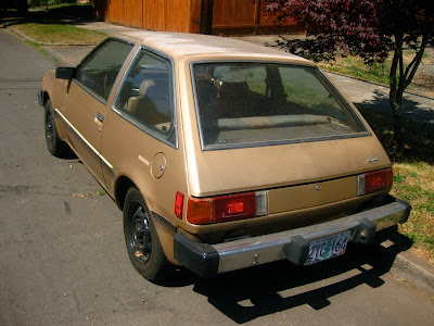 OLD PARKED CARS.: 1980 Dodge Colt Hatchback.