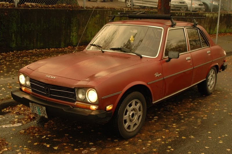 OLD PARKED CARS.: 1979 Peugeot 504 Diesel Sedan and Brendan.