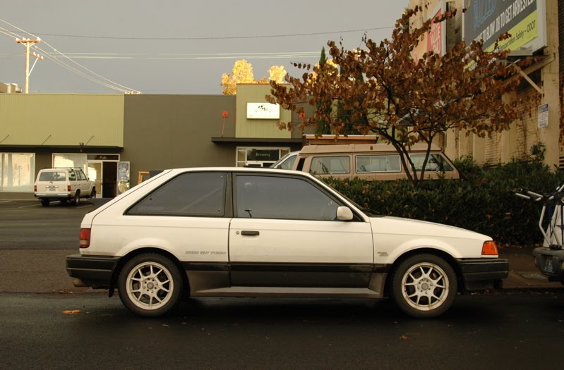 OLD PARKED CARS.: 1988 Mazda 323 GTX Turbo 4wd.