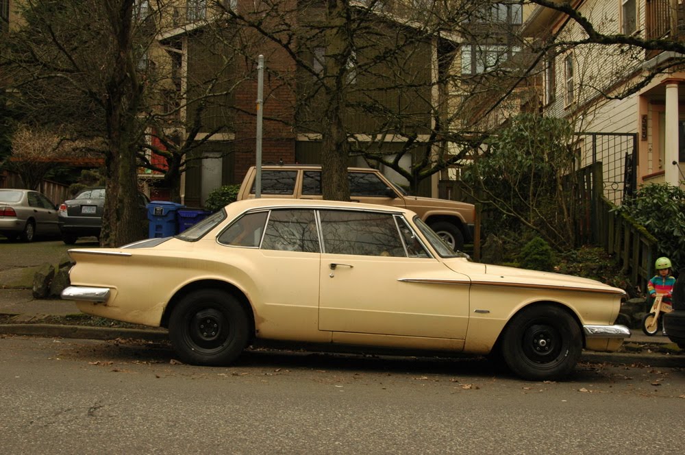 OLD PARKED CARS.: 1962 Plymouth Valiant Signet 200 Coupe.