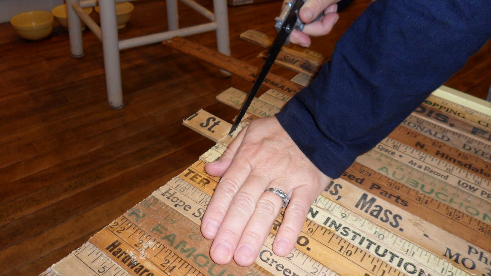 reclaimed crafts: vintage yardsticks + old Ikea table = funky, cool table