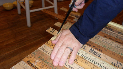 reclaimed crafts: vintage yardsticks + old Ikea table = funky, cool table