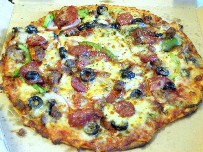 what is on dominos extravaganza pizza