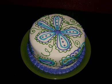 Kaci's Cake Delight: Two Layered Cake with a Floral & Paisley Design