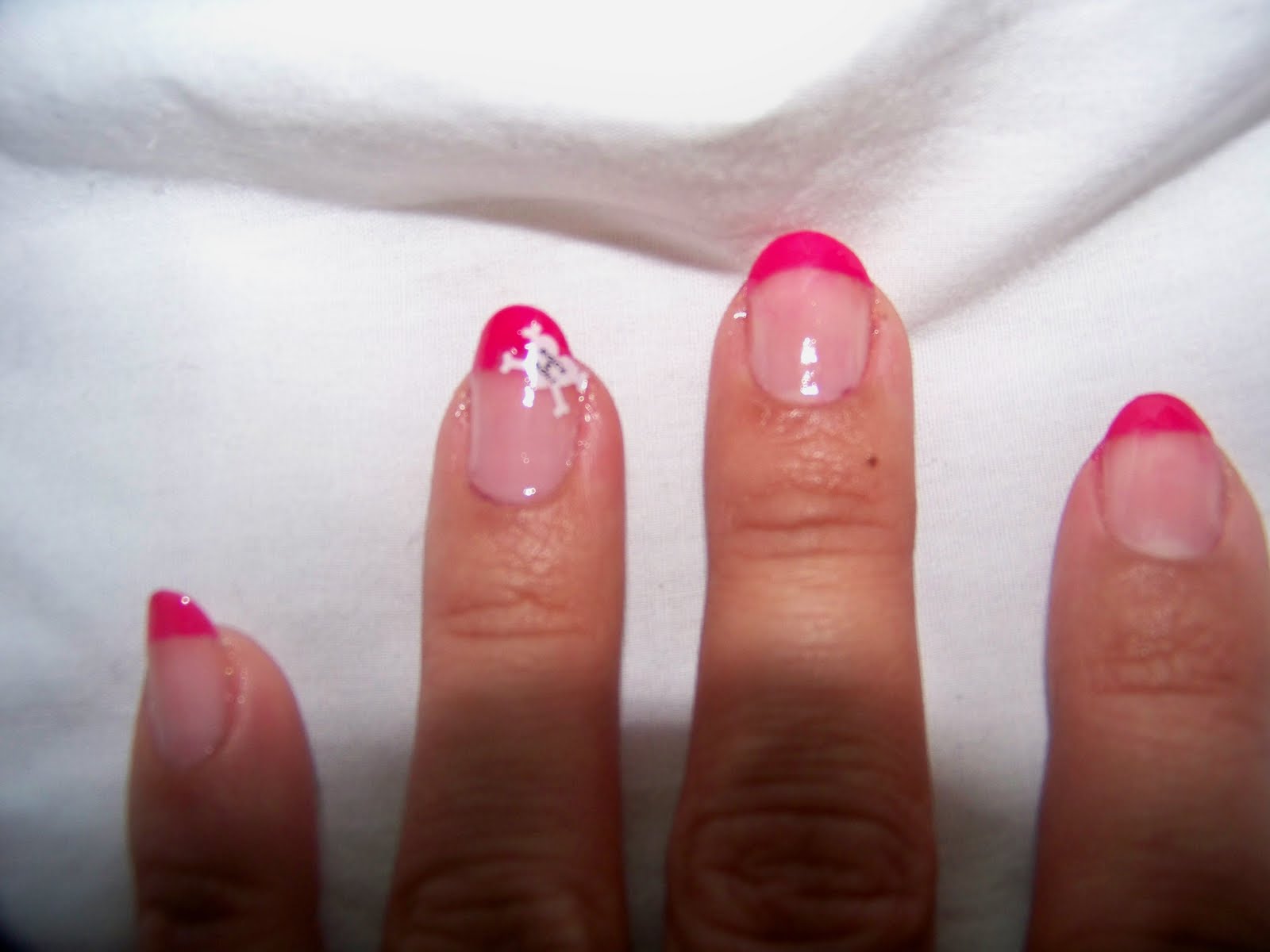 creativejackie831: Hot Pink French tips with a crossbone heart.