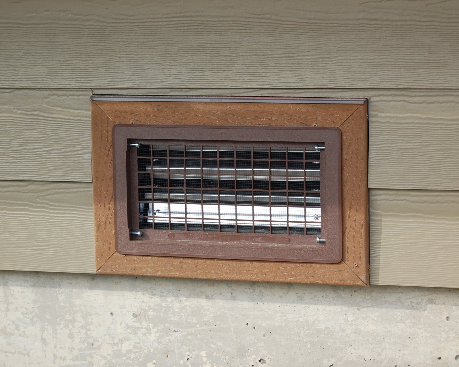 Expanding the farm at Bow: Wrap, vents and siding.