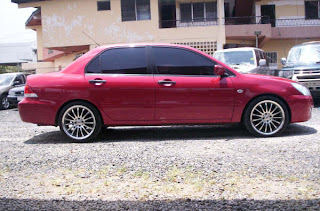 "PANAMA RACING SOLUTION": Precioso Mitsubishi Lancer 2006, Color Rojo