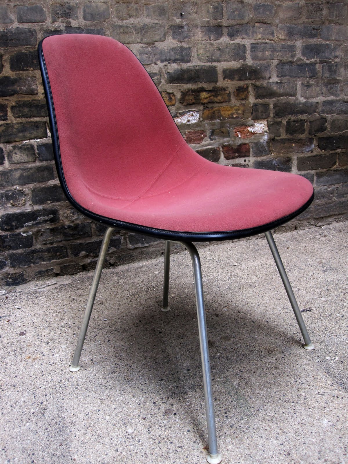 circa midcentury: 'eames' shell chair (red)