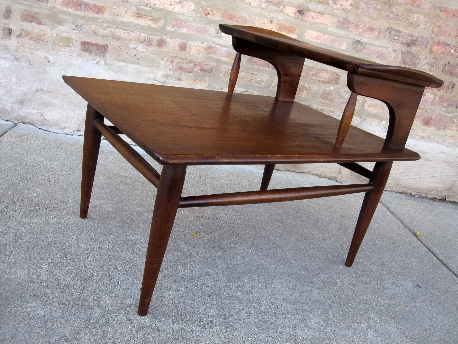 circa midcentury: 'bassett' walnut step table