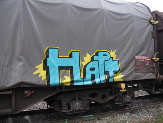 painting walls: graffiti alphabet letters "HAPT" railway gate