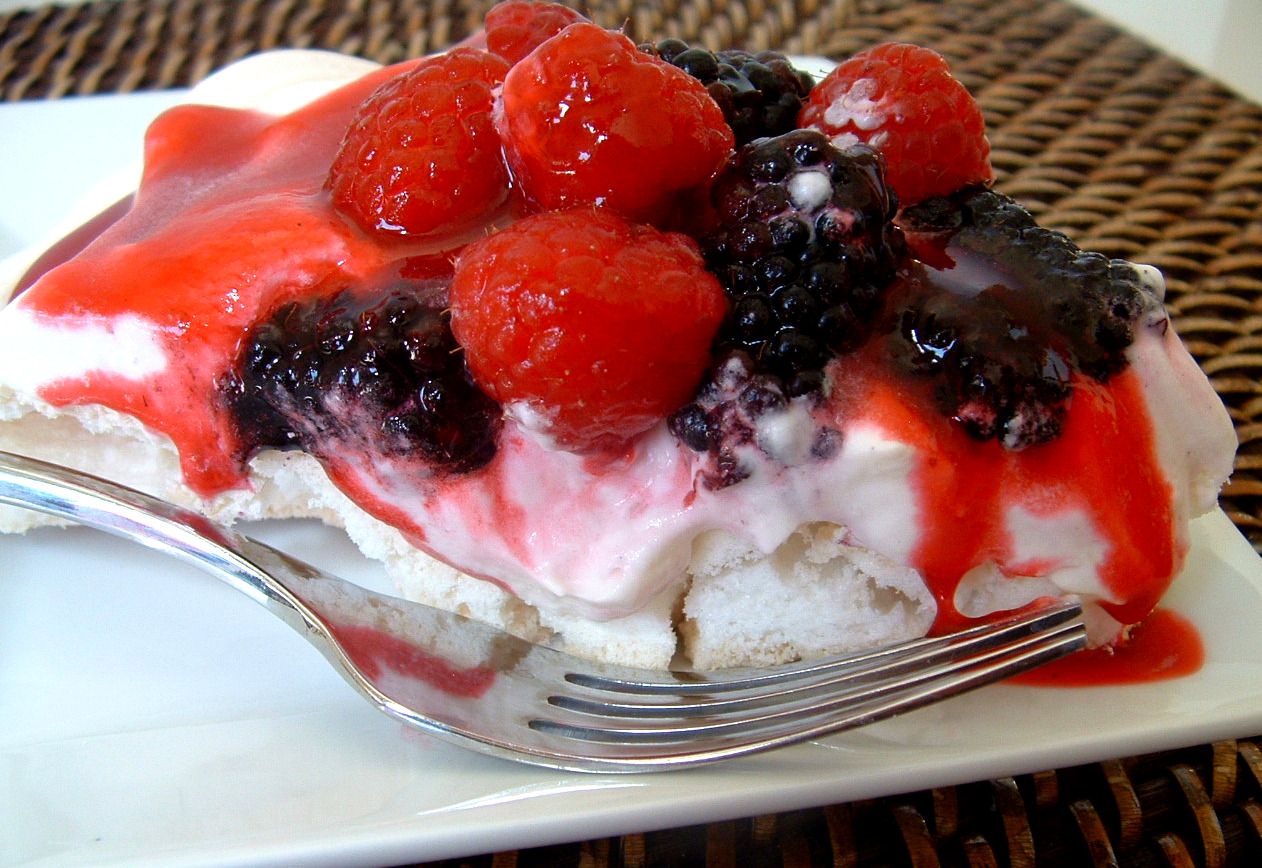 Summer Berry Pavlova with a Raspberry Coulis Sauce - A Feast For The Eyes