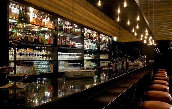 Poised Perfection: Mirror Mirror Behind the Bar
