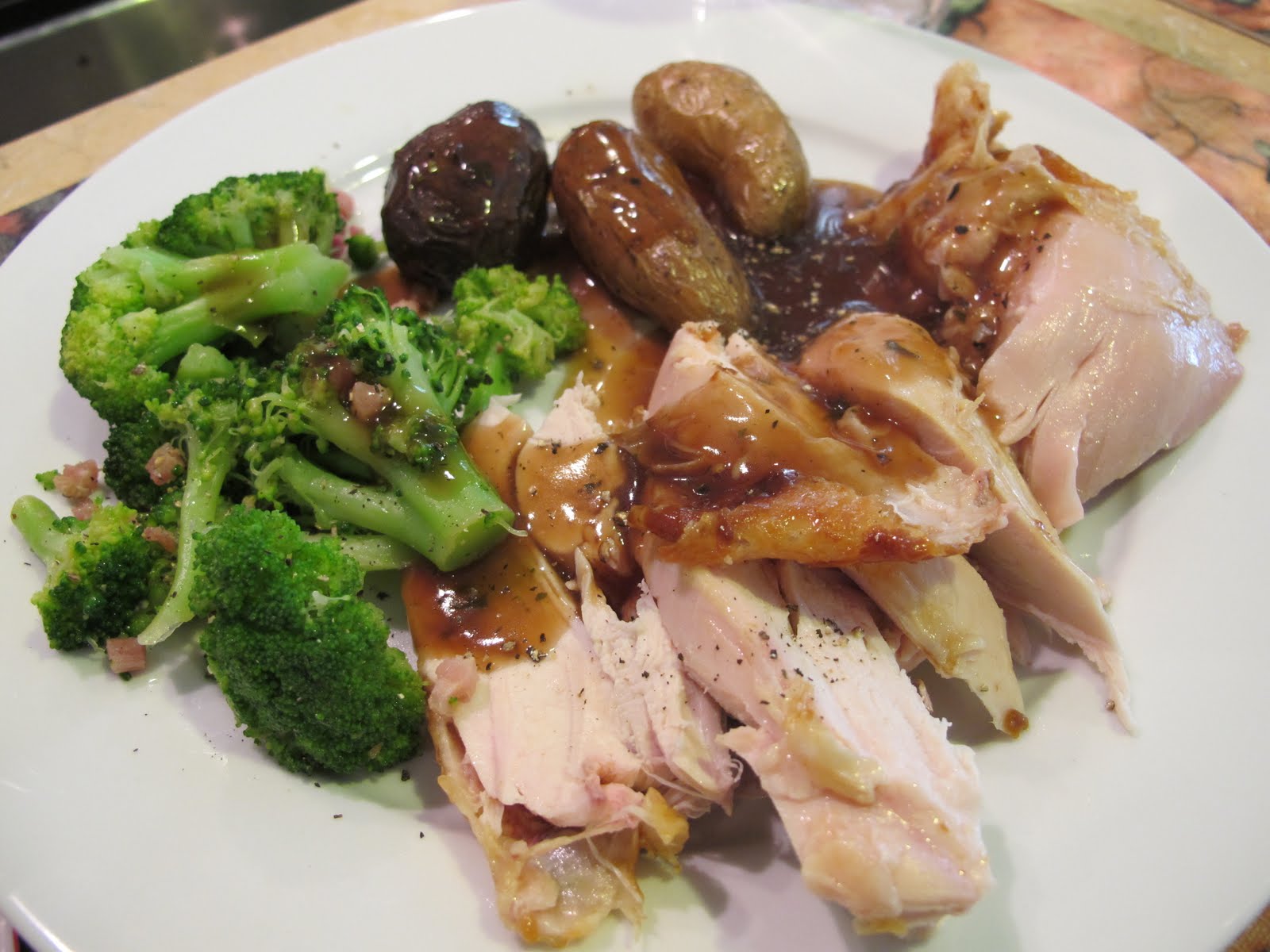 Classy Eats: British dinner: chicken, potatoes and broccoli with gravy.