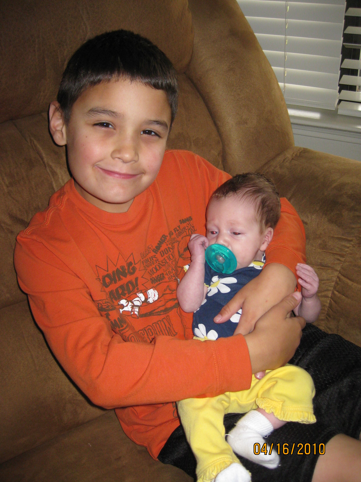 Our Family: Luke holding his baby sister