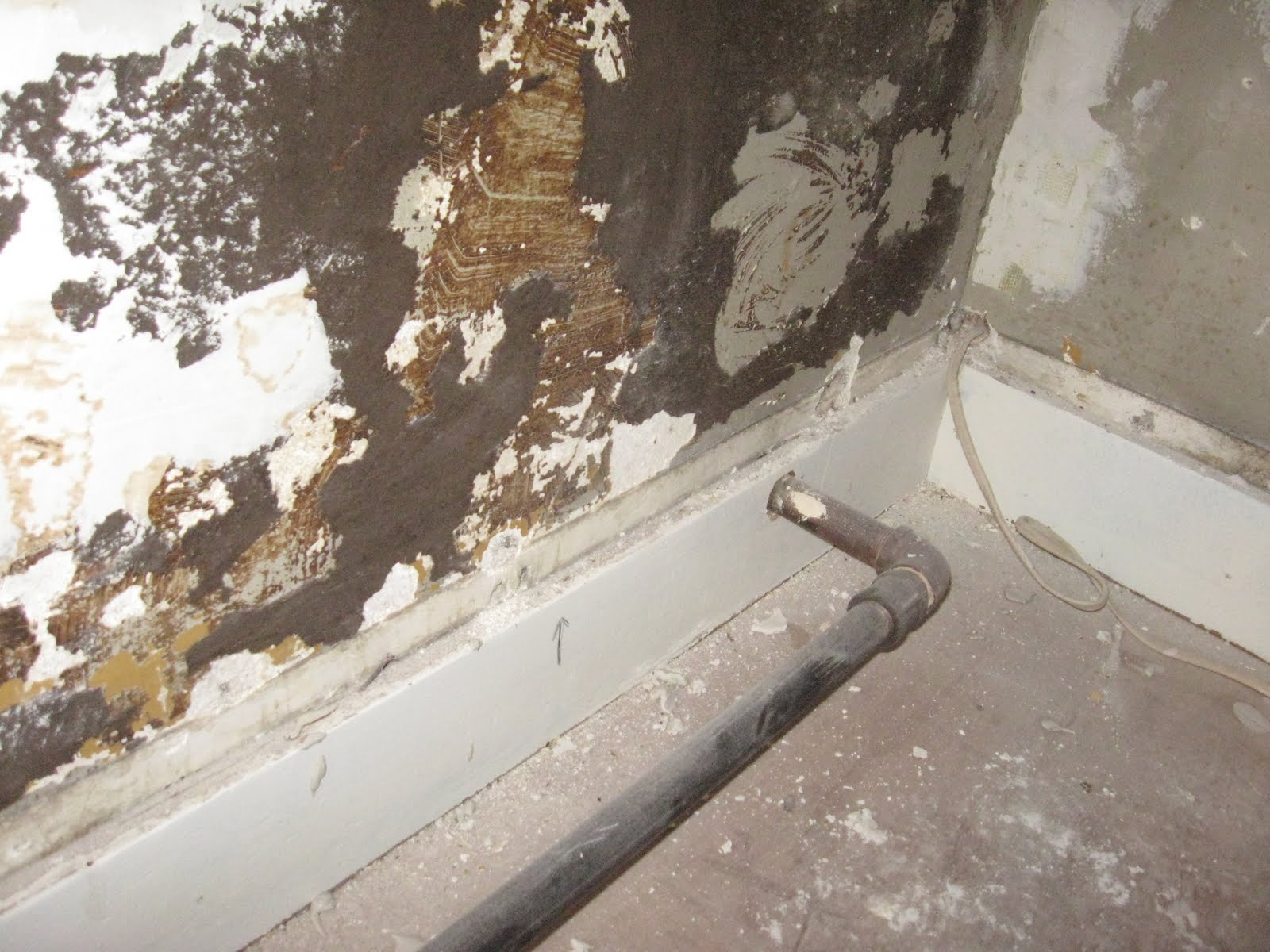 Here is a close-up of the pipe coming out of the wall: