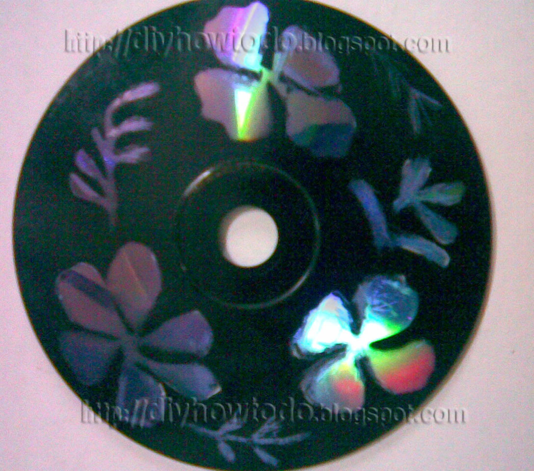 DIY old CD to art work or decoration. - D . I . Y . Done ! It 's Yours
