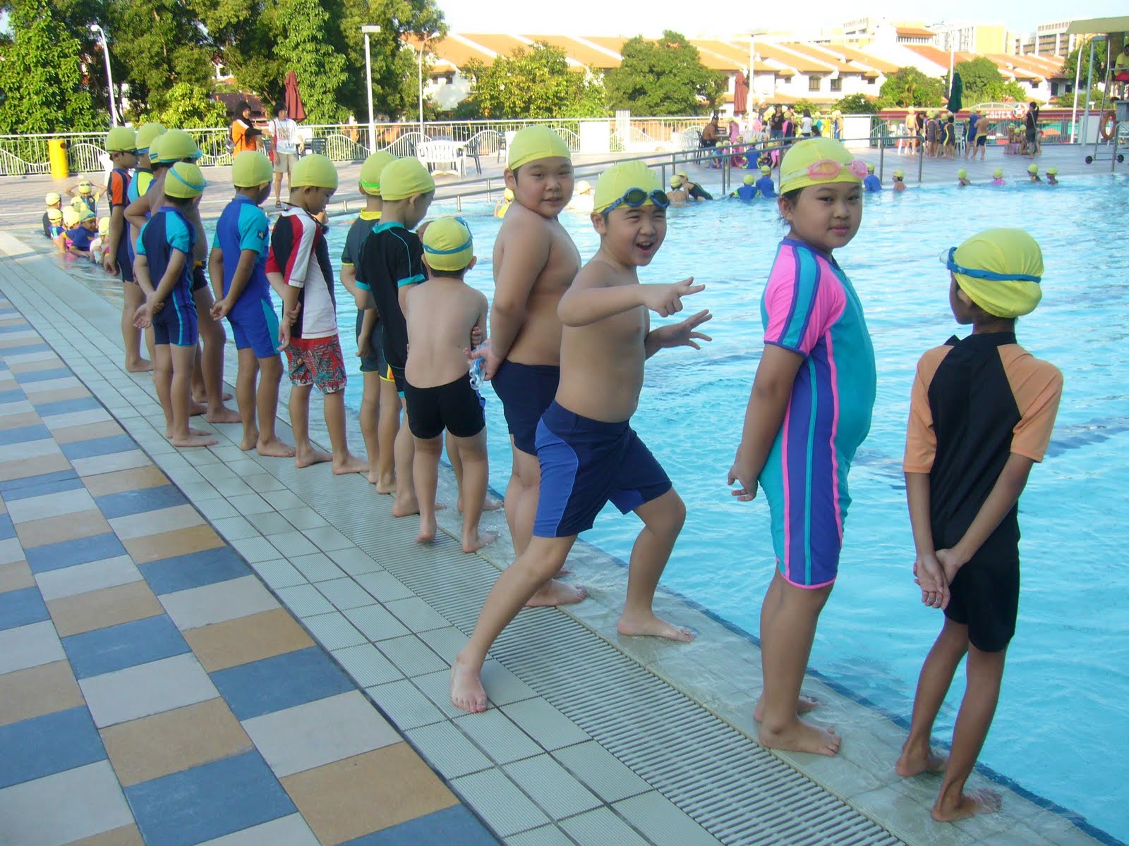 The pupils waiting anxiously for the swimming boards to be issued.